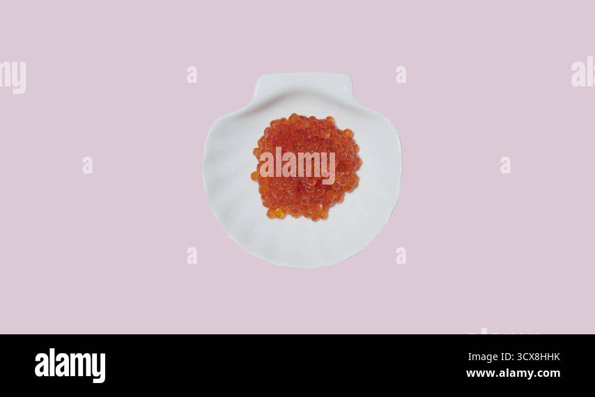 Animated pink background with red caviar in a plate Stock Video Footage ...