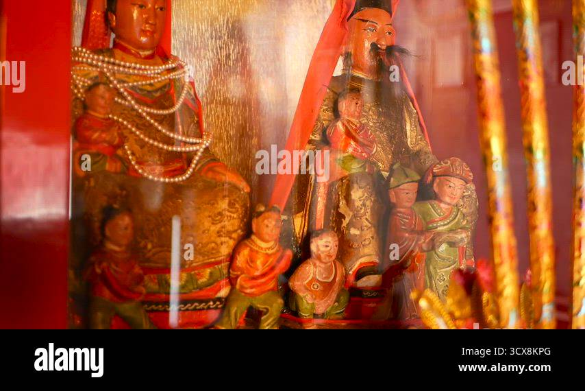 Buddhist traditional statues of chinese sacred gods on the altar inside ...