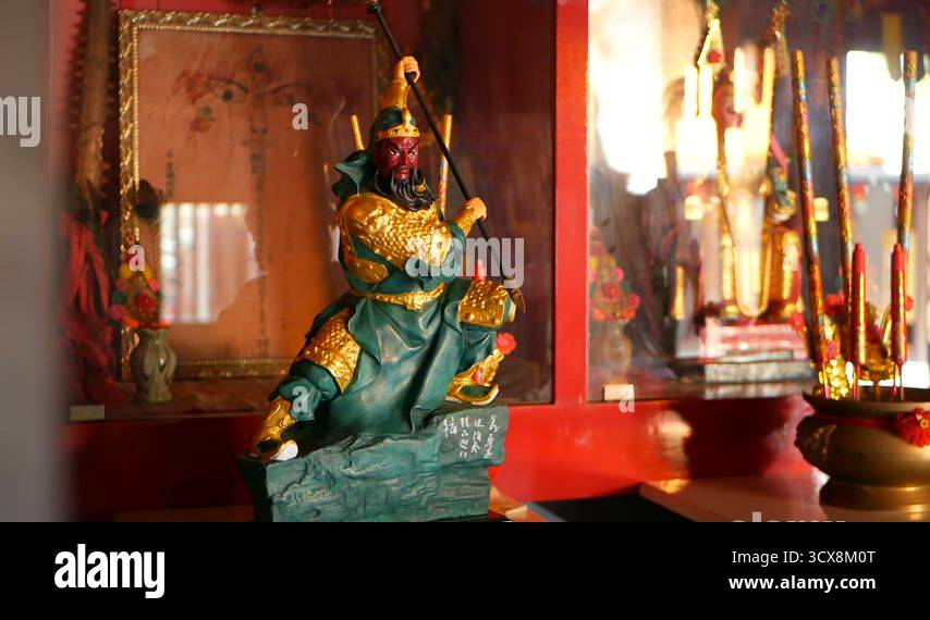 Buddhist traditional statues of chinese sacred gods on the altar inside ...