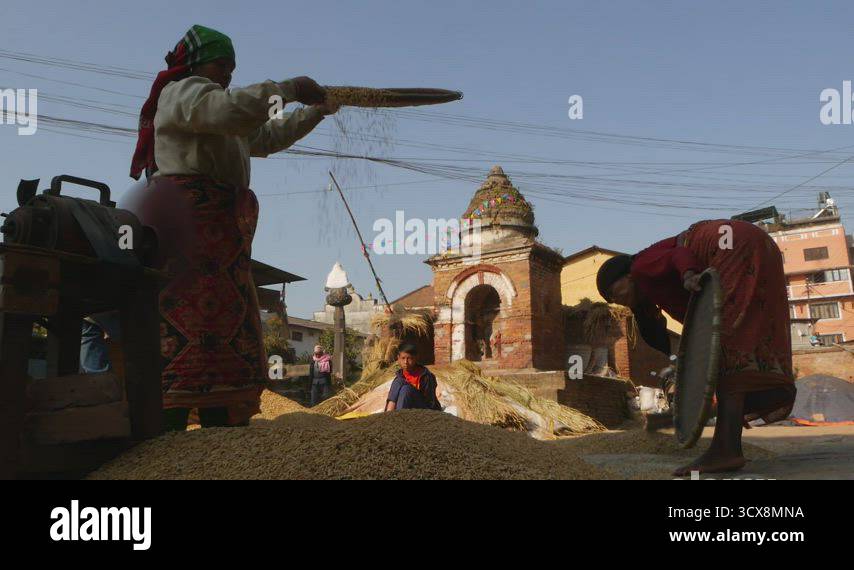 BHAKTAPUR, KATHMANDU, NEPAL - 18 October 2018 Aged asian women drying ...