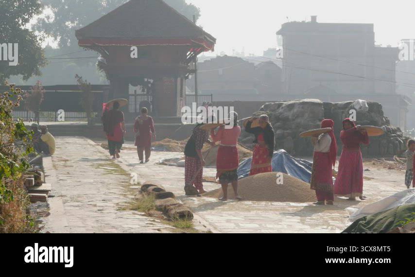 BHAKTAPUR, KATHMANDU, NEPAL - 18 October 2018 Aged asian women drying ...