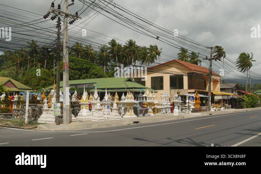 KOH SAMUI ISLAND, THAILAND - 24 JUNE 2019 Deserted road with spirit ...