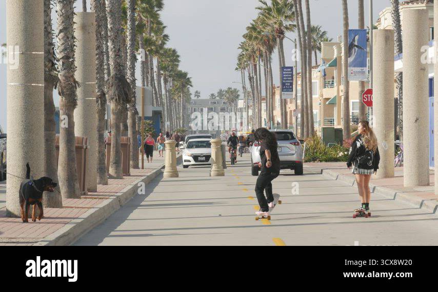 People walking, waterfront promenade beachfront boardwalk. Ocean beach ...