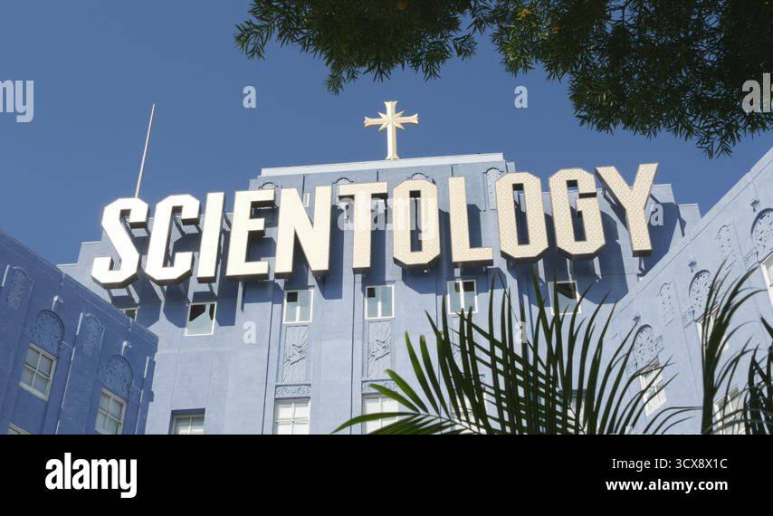 Church of Scientology exterior, facade of blue building, logo and cross ...