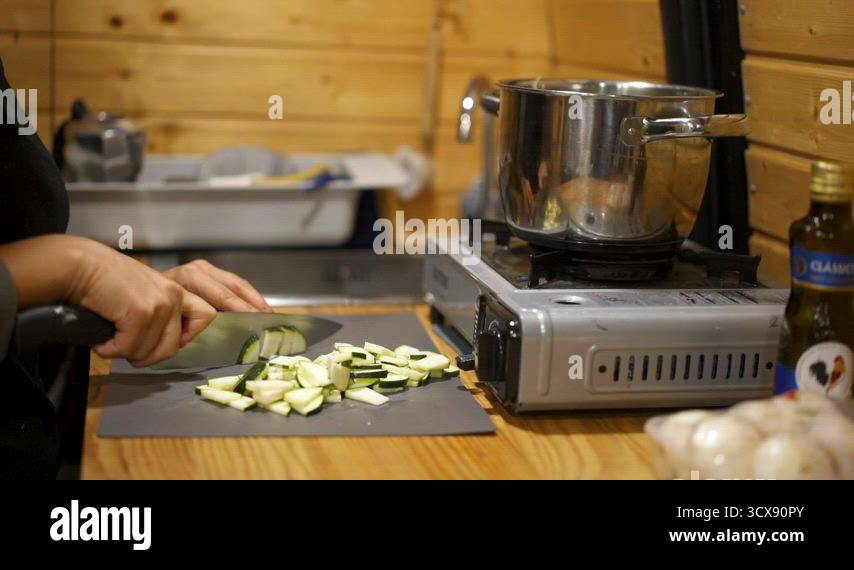 Caucasian woman cutting zucchini courgette Stock Videos & Footage - HD ...