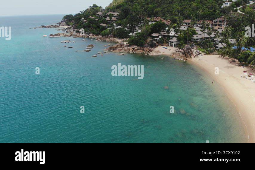 Small houses on tropical island. Tiny cozy bungalows located on shore ...