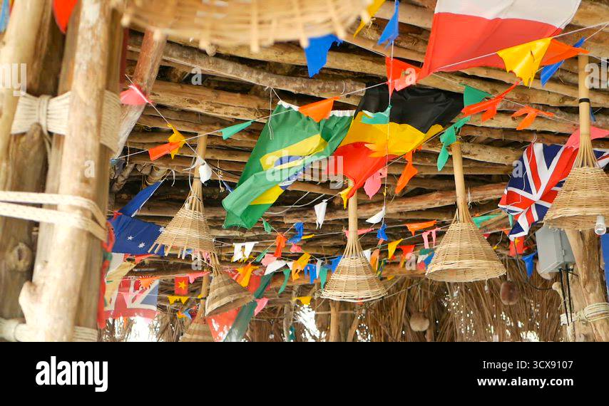 Decorative national flags of different countries hanging on strings in ...