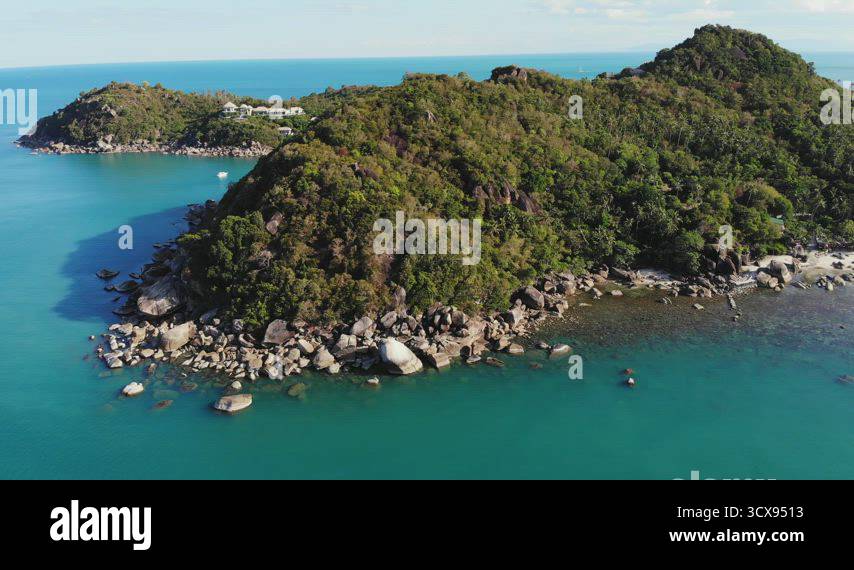 Calm sea near tropical volcanic island. Drone view of peaceful water of ...