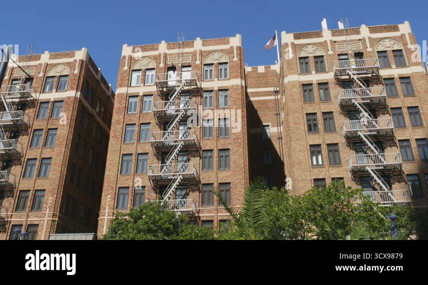Fire escape ladder outside residential brick building in San Diego city ...