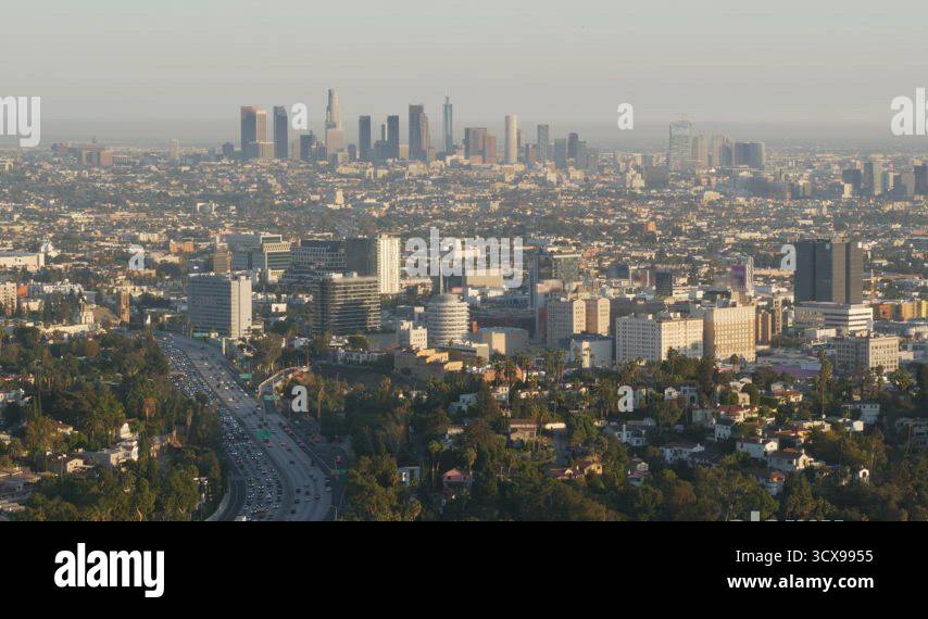 Highrise skyscrapers of metropolis and busy rush hour highway, Los ...