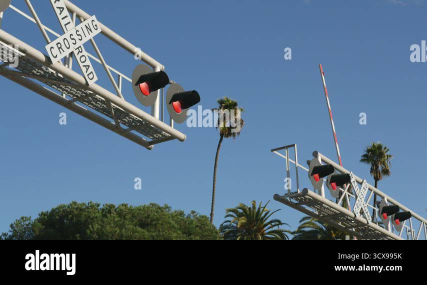 Level crossing warning signal in USA. Crossbuck notice and red traffic ...