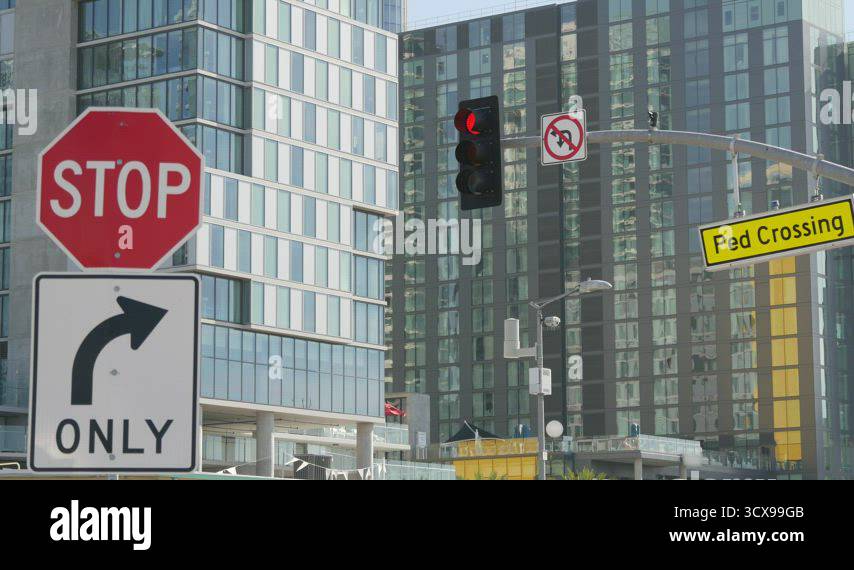 Traffic light and caution sign, road intersection in USA ...