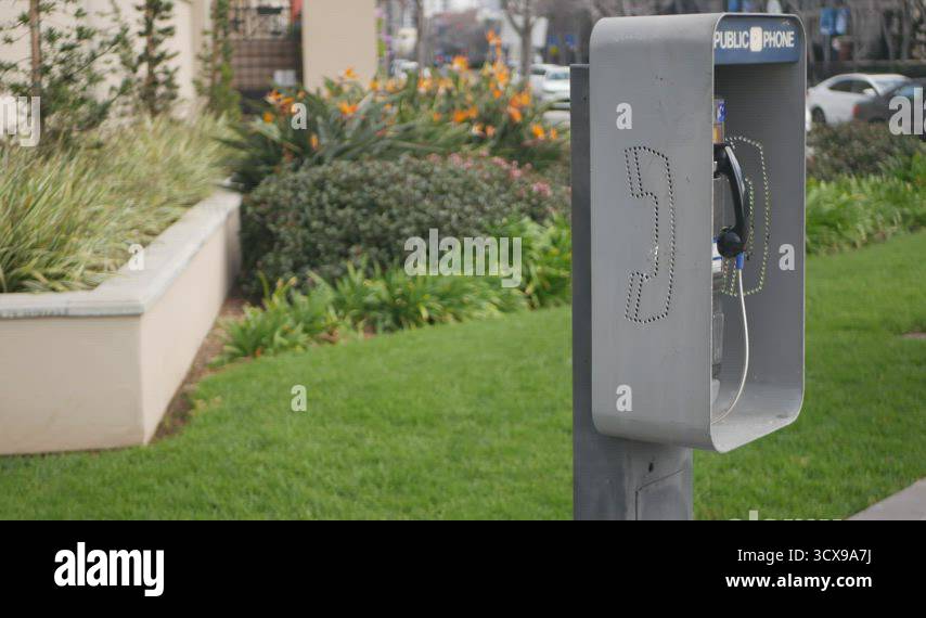 Retro coin-operated payphone station for emergency call on street ...