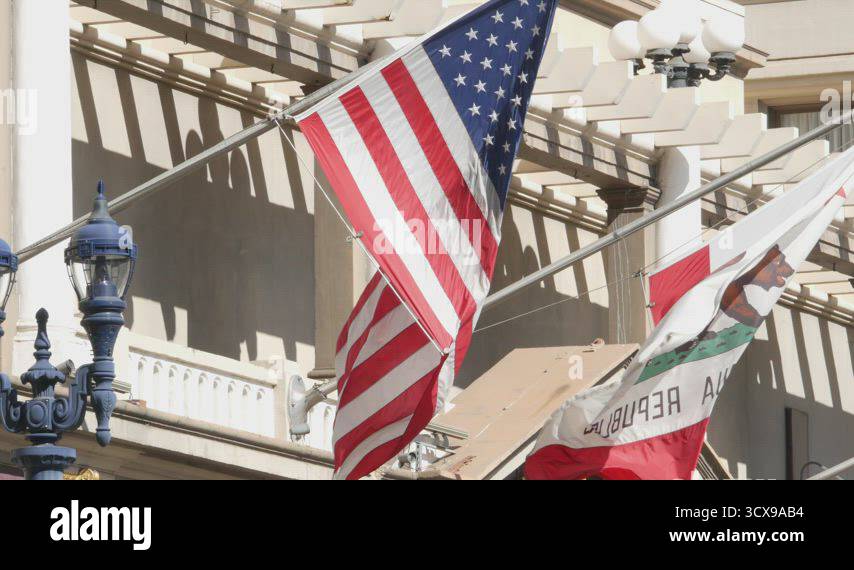 Flags of California and United States waving on flagpole in Gaslamp ...