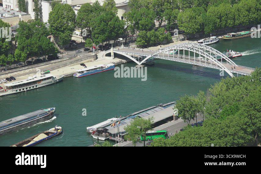 Traffic of cargo and tourist boats on Seine river near Eiffel tower ...