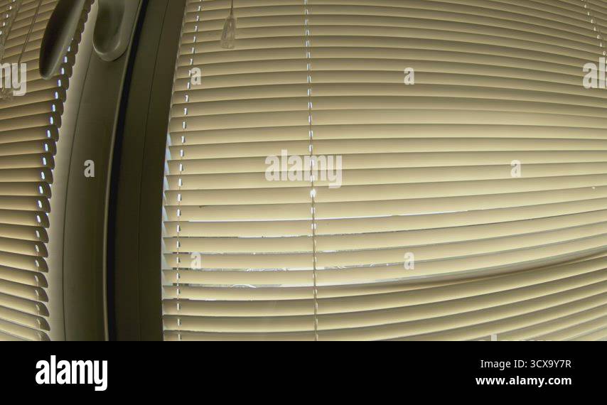 Sunset sun shining through window blinds Stock Video Footage - Alamy