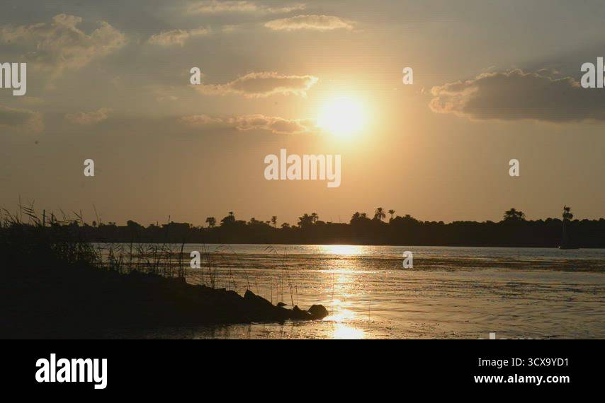 River bank silhouette at dusk sunset Stock Video Footage - Alamy