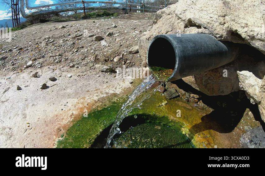 Hot Mineral Spring Pouring Down from plastic pipe, slow motion Stock ...