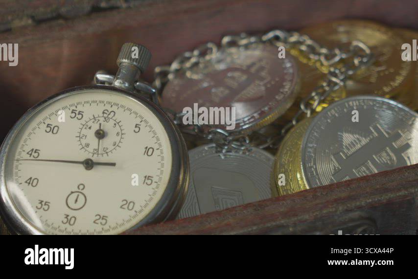 Bitcoin BTC with stopwatch lies on bills. Time is money concept Stock ...