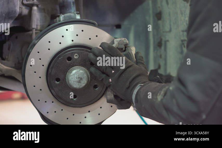Mechanic performs maintenance on the brakes Stock Video Footage - Alamy