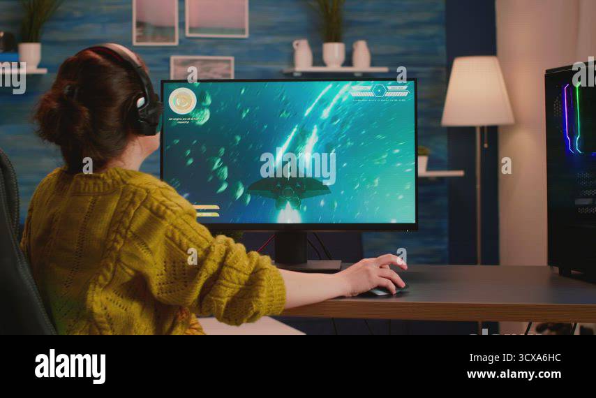 Professional gamer playing and winning in space shooter online game ...