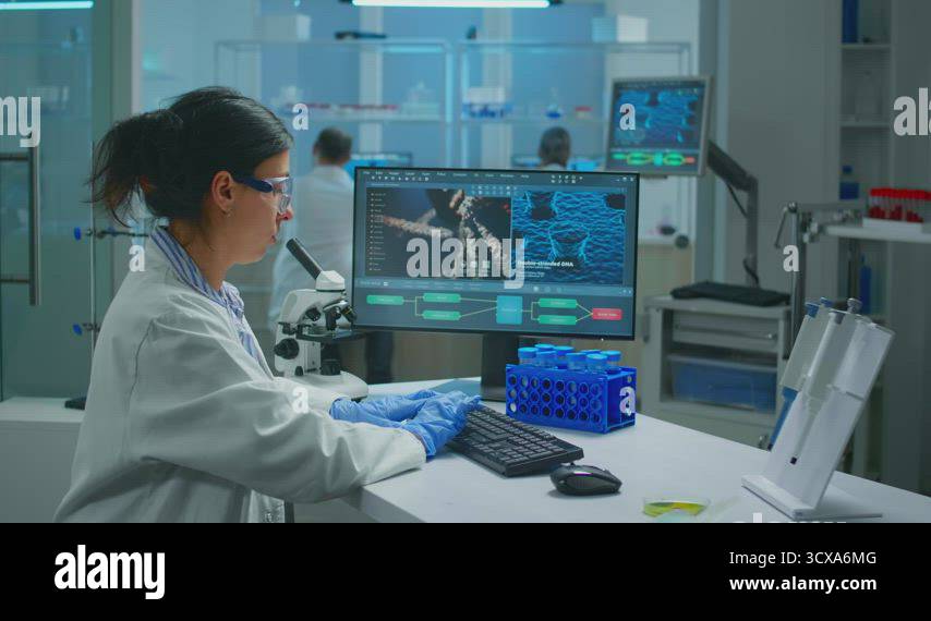 Group of scientists working in laboratory examining biochemistry sample ...