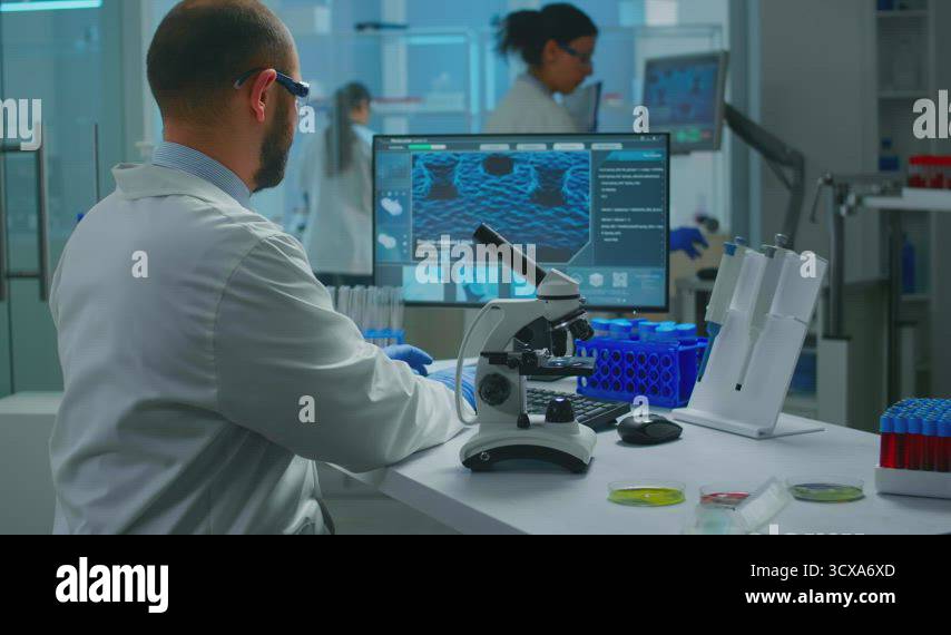 Medical research scientist conducting vaccine development under digital ...