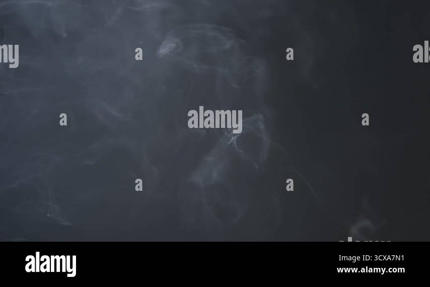 Abstract white smoke. Smoke, a cloud of cold fog on a black background ...