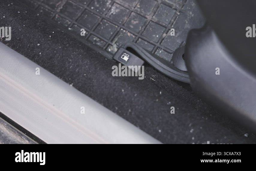 Opening the fuel filler flap with a special button near the driver's ...