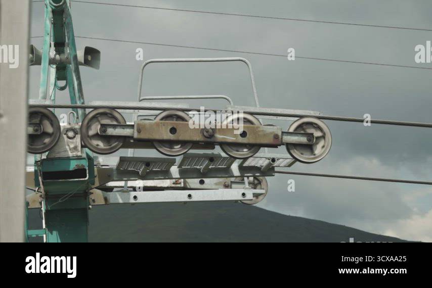 Mountain ski cable lift mechanism in action. Rollers and bearings ...