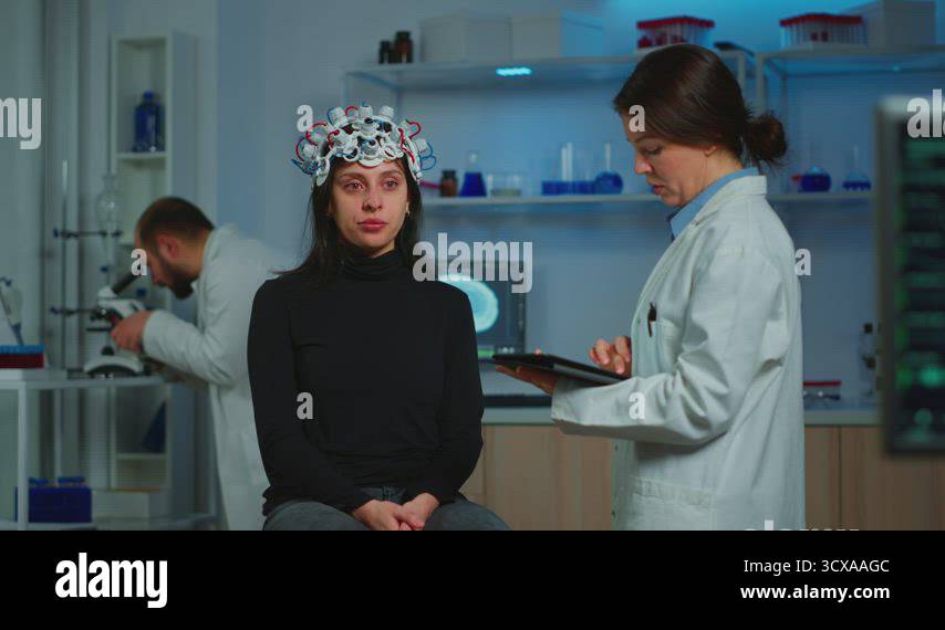 Stressed patient sitting on neurological chair with eeg headset Stock ...