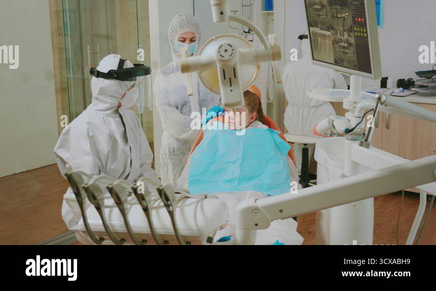 Child with ppe suit taking care of dental health during coronavirus ...