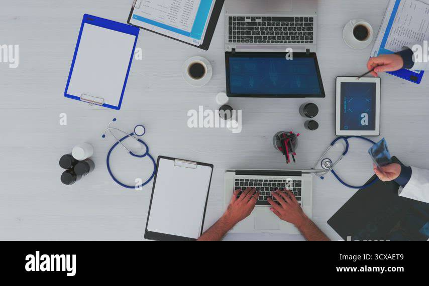 Top view of doctor explaining to resident physician patient problems ...