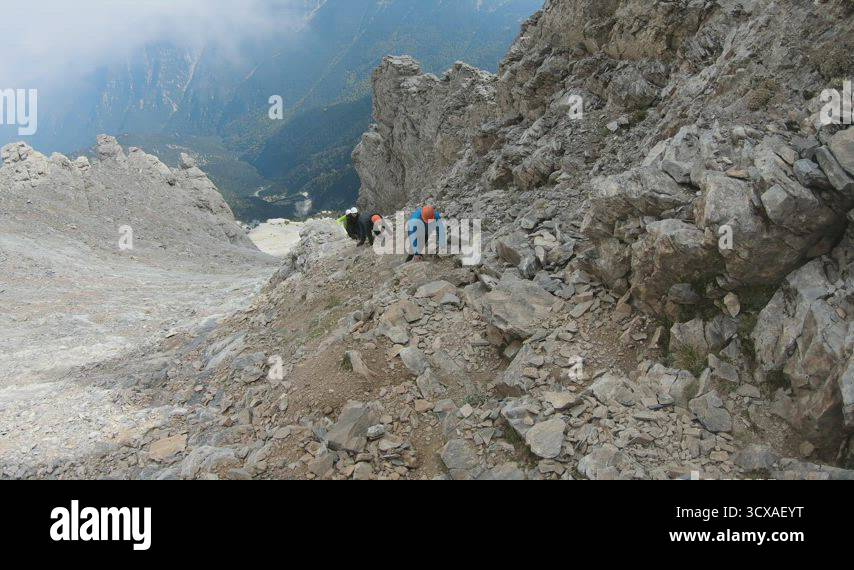 Climbers on the trail from Scala summit to Mytikas summit, the highest ...