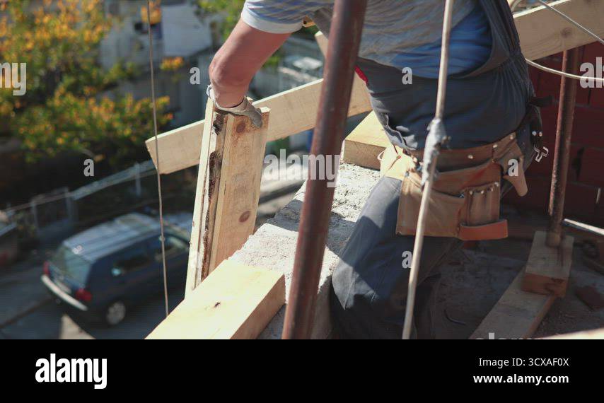 Carpenter lifting roof top construction Stock Videos & Footage - HD and ...