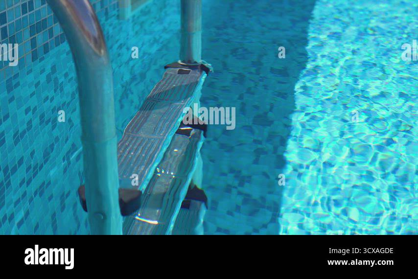 Swimming pool metal stairs in a luxury resort Stock Video Footage - Alamy