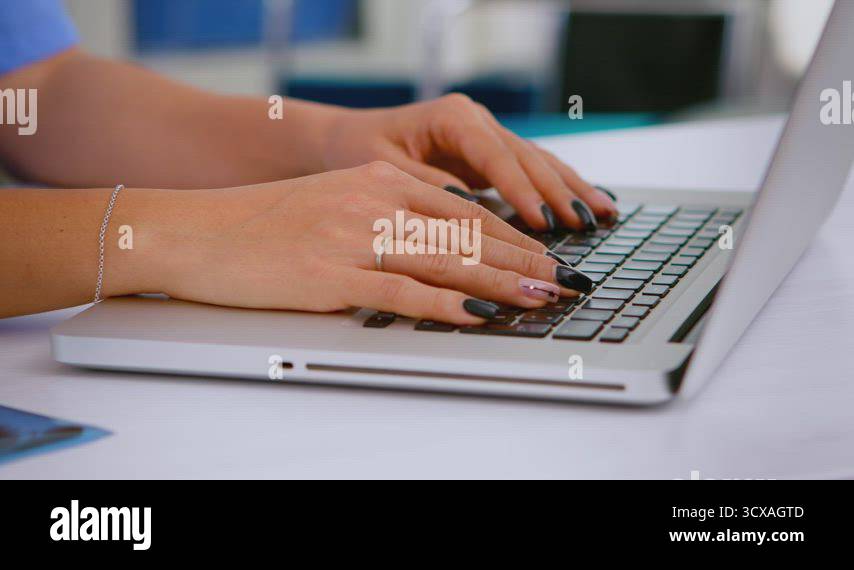 Close up of medical assistant typing patient appointment Stock Video ...