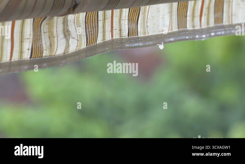 Rain drops falling down from the umbrella during storm Stock Video ...