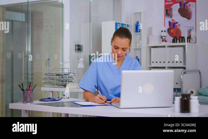 Smiling nurse writing report Stock Videos & Footage - HD and 4K Video ...