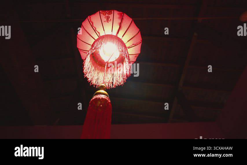 a traditional chinese lamp in china town in restaurant, dark atmosphere ...