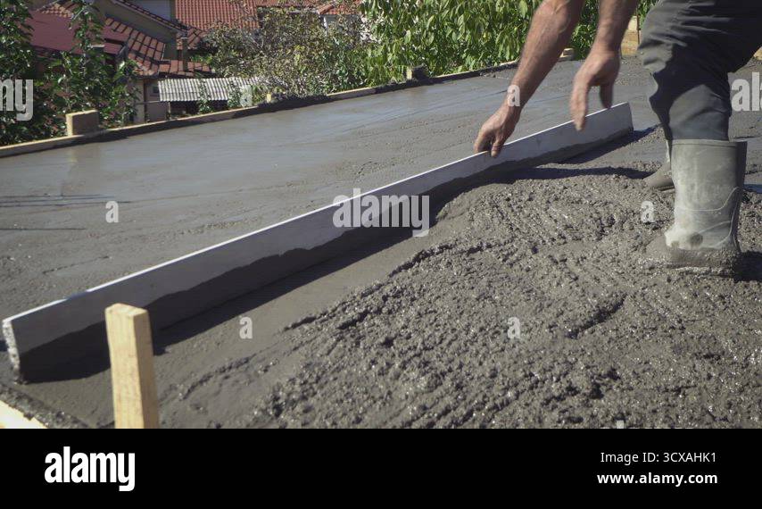 Mason worker leveling concrete trowels Stock Videos & Footage - HD and ...