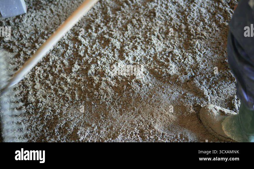 Tool for smooth concrete surface. Worker with tool makes a smooth ...
