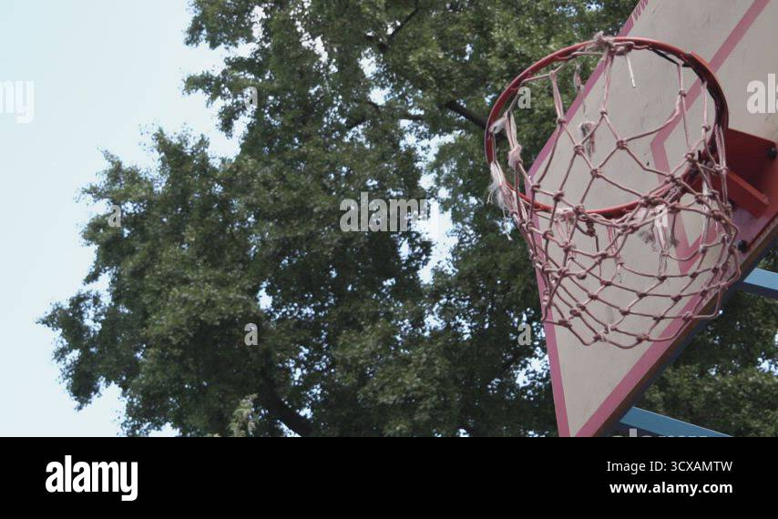 Caucasian man basketball street player hand throws the ball up into ...