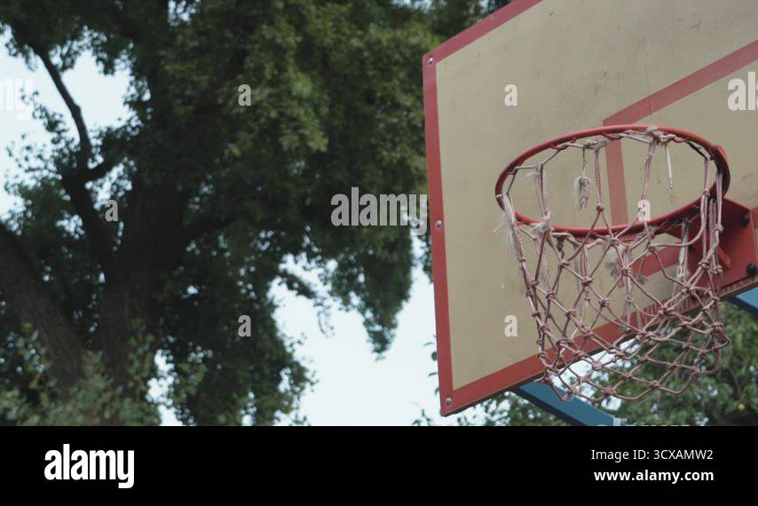 Orange basketball thrown miss the basket not hit target on a outdoor ...