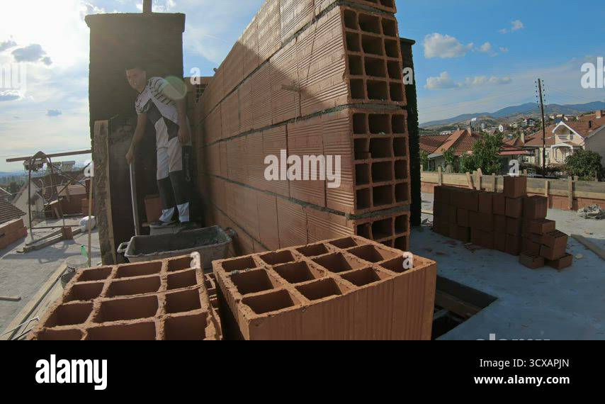 Mason builds wall house Stock Videos & Footage - HD and 4K Video Clips ...