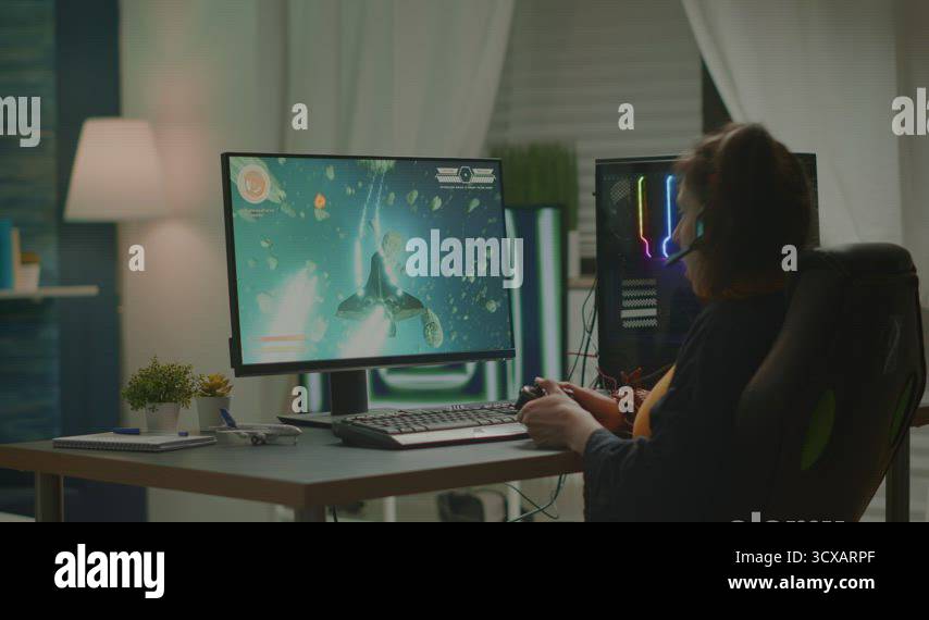 Back view shot of excited woman gamer wining online video games Stock ...