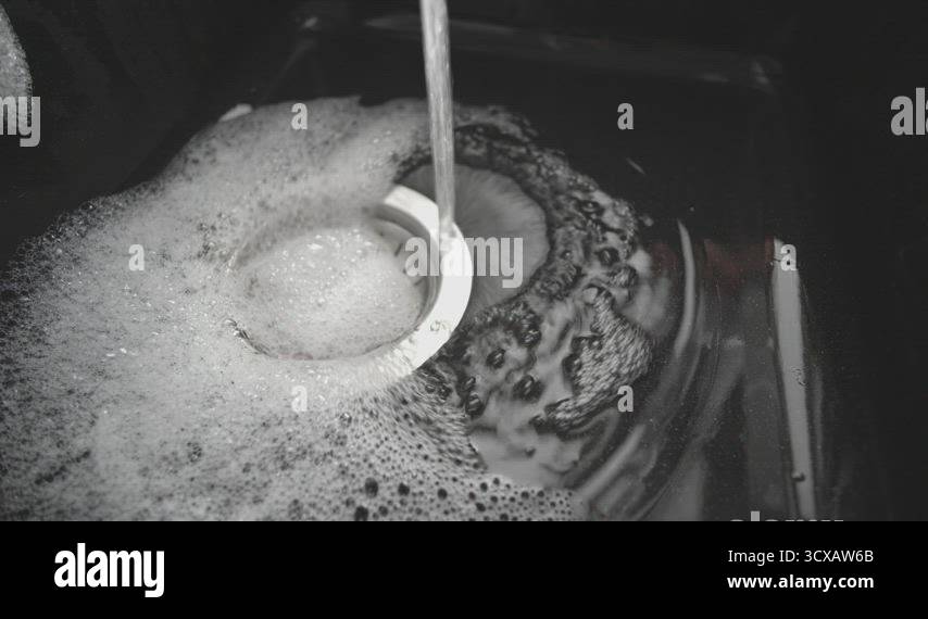 Streaming water in sink. Water stream going down the drain Stock Video ...