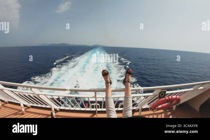 Legs of a young woman at the railing of a cruise ship Stock Video ...