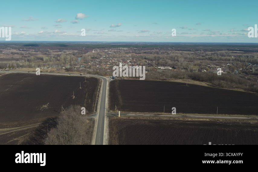 Arial drone view of freshly plowed field ready for seeding and planting ...