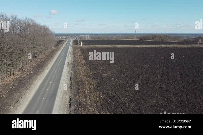 Arial drone view of freshly plowed field ready for seeding and planting ...